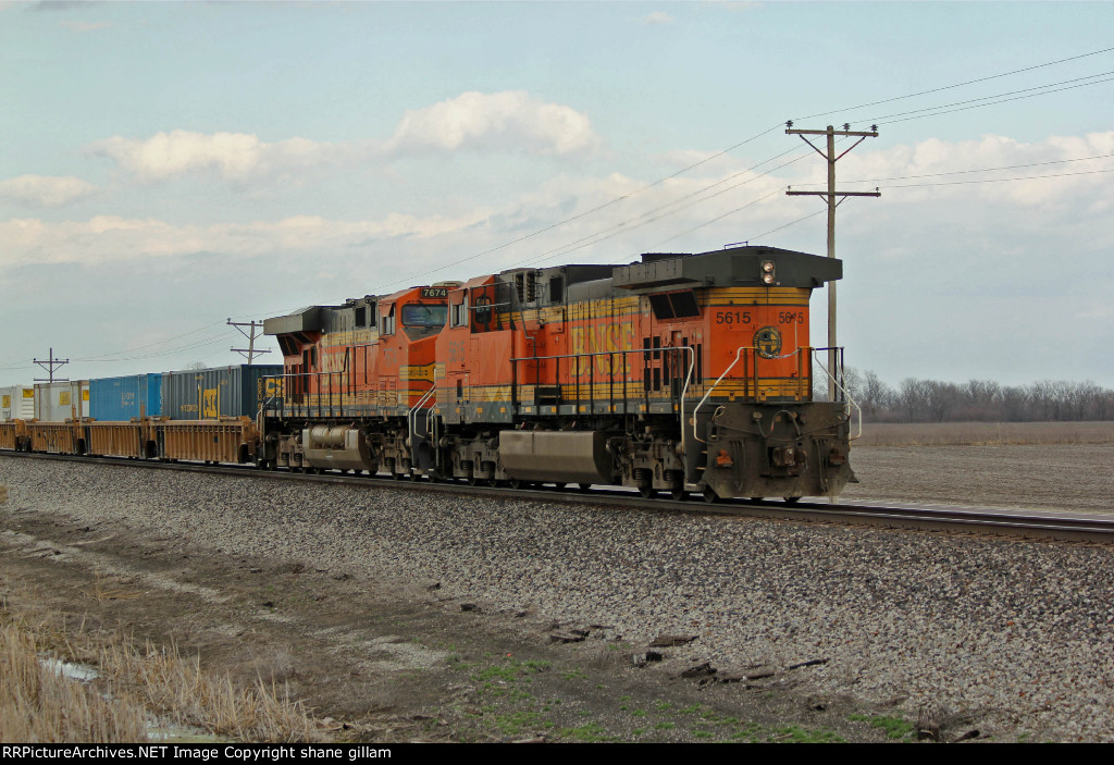 BNSF 5615 coal power on a stack train.